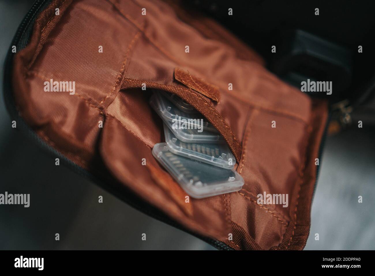 the memory cards inside small transparent container put into an inside ...