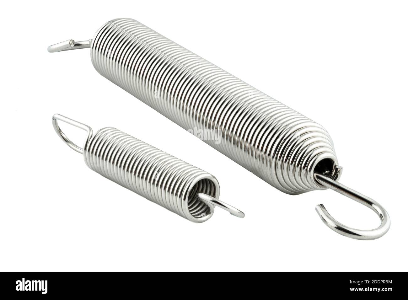 Two new steel springs lying next to each other, isolated on a white ...