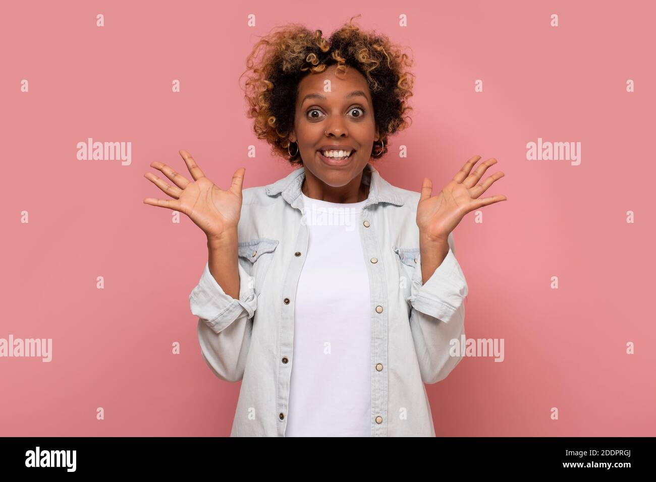 Young african american woman with surprise expression on face face ...