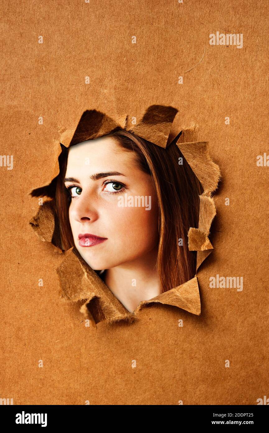 Face behind ripped paper hi-res stock photography and images - Alamy