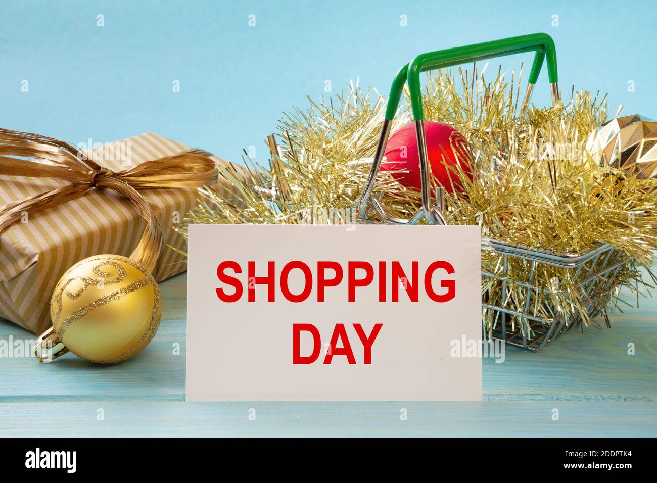 Shopping basket and text SHOPPING DAY on white paper note list ...