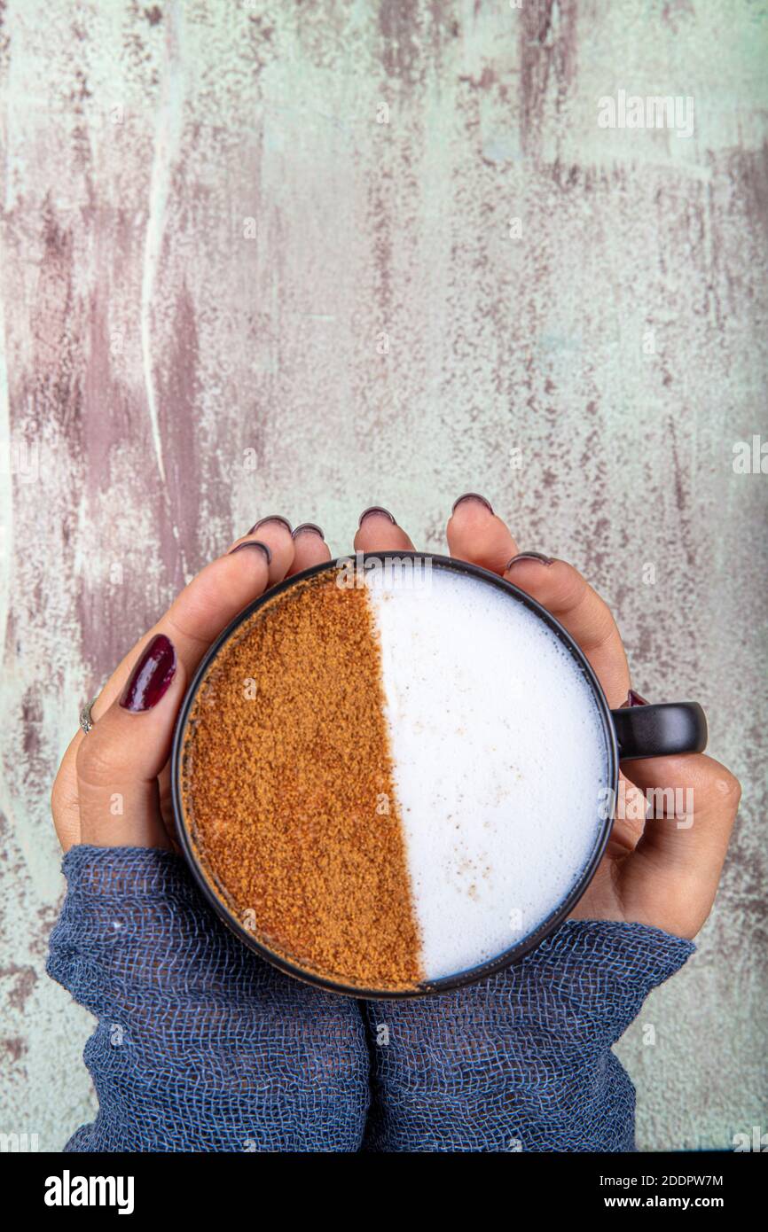 Girl's hand hold Traditional Turkish Drink Salep. Turkish salep (milky ...