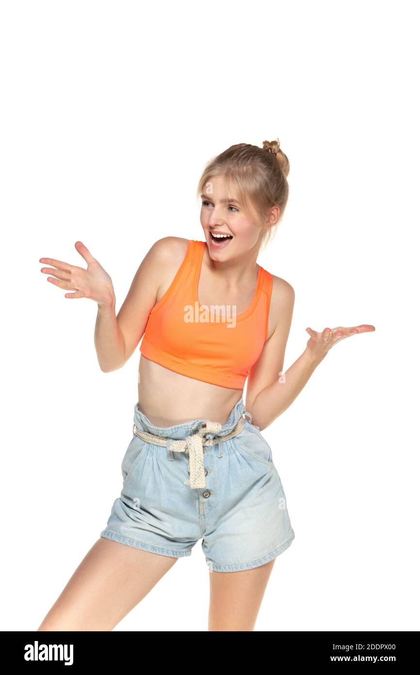 Cheerful female model in casual bright wear isolated on white ...