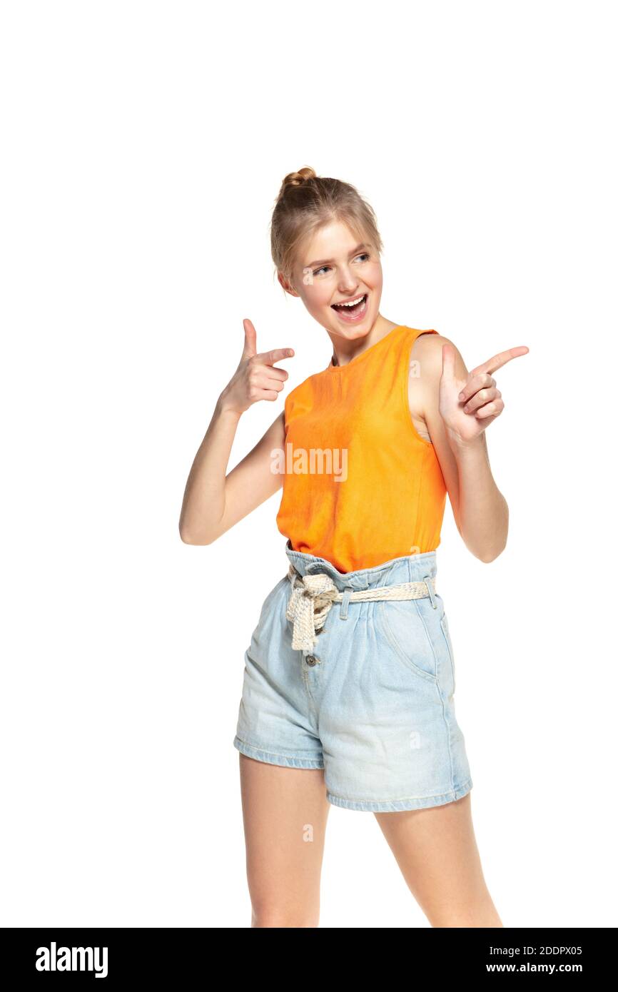 Beautiful and happy model in casual bright wear isolated on white ...