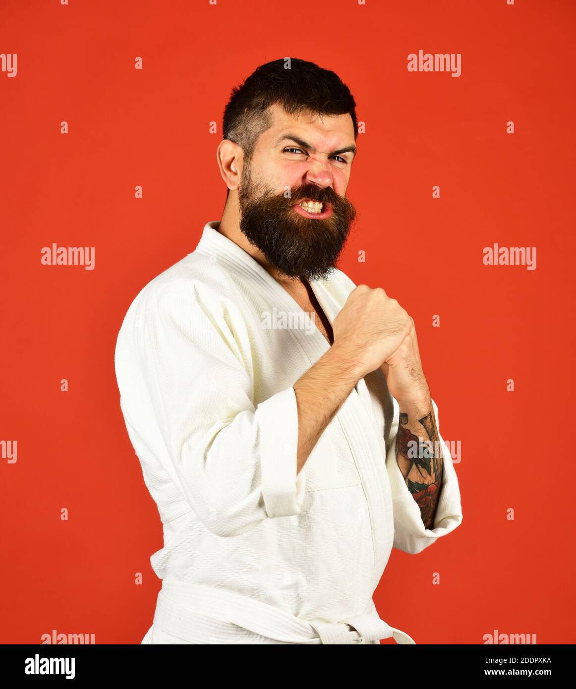 Training and combat concept. Karate man with raging face in uniform ...