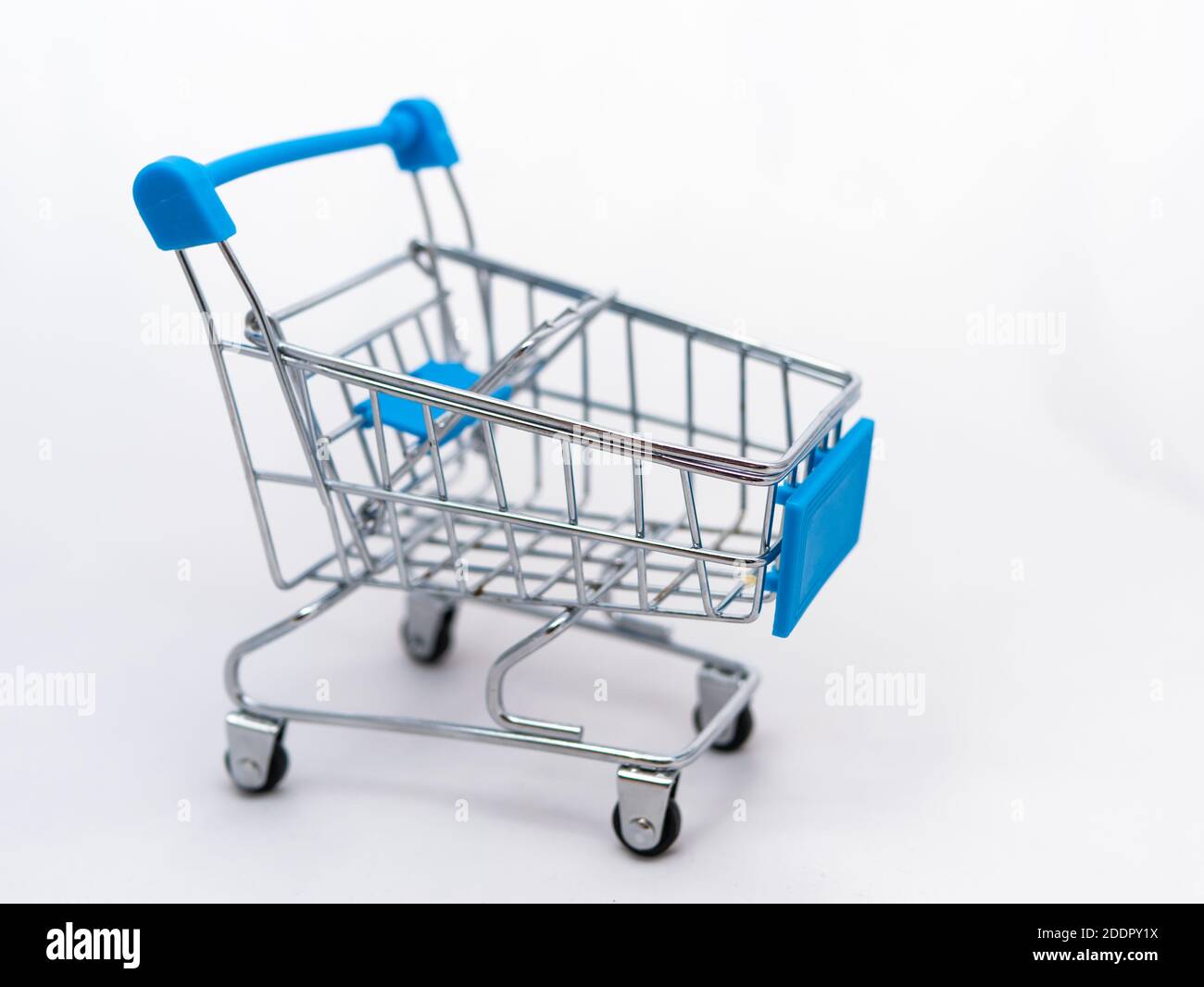 Mini empty grocery cart isolated on white background Stock Photo - Alamy