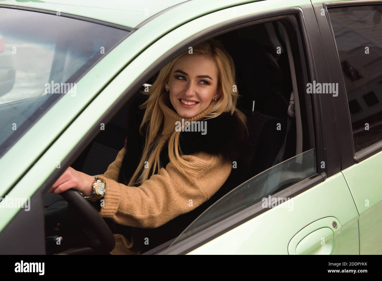 Beautiful happy girl on car window, young woman driving her car Stock ...