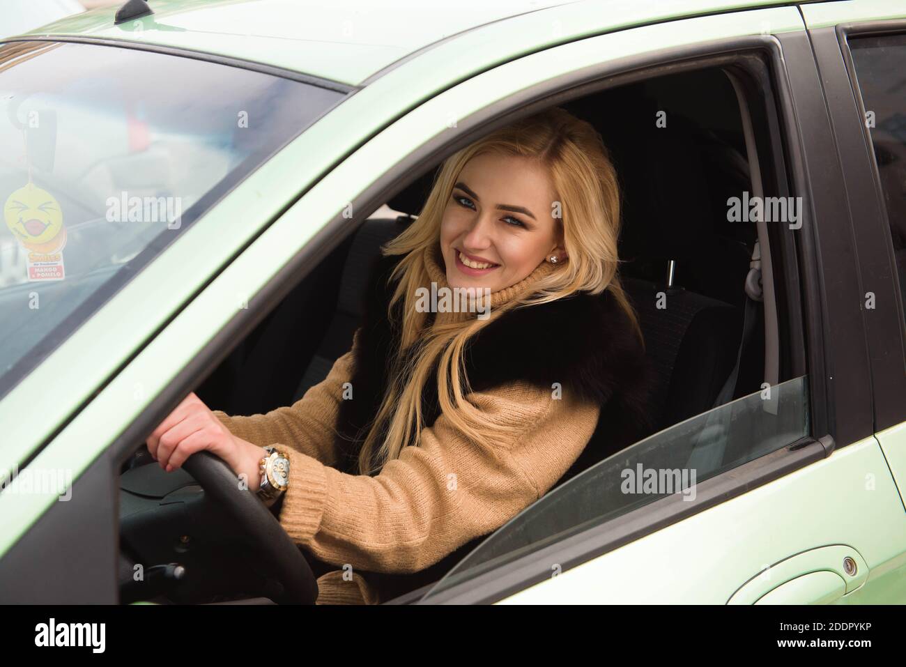Beautiful happy girl on car window, young woman driving her car Stock ...