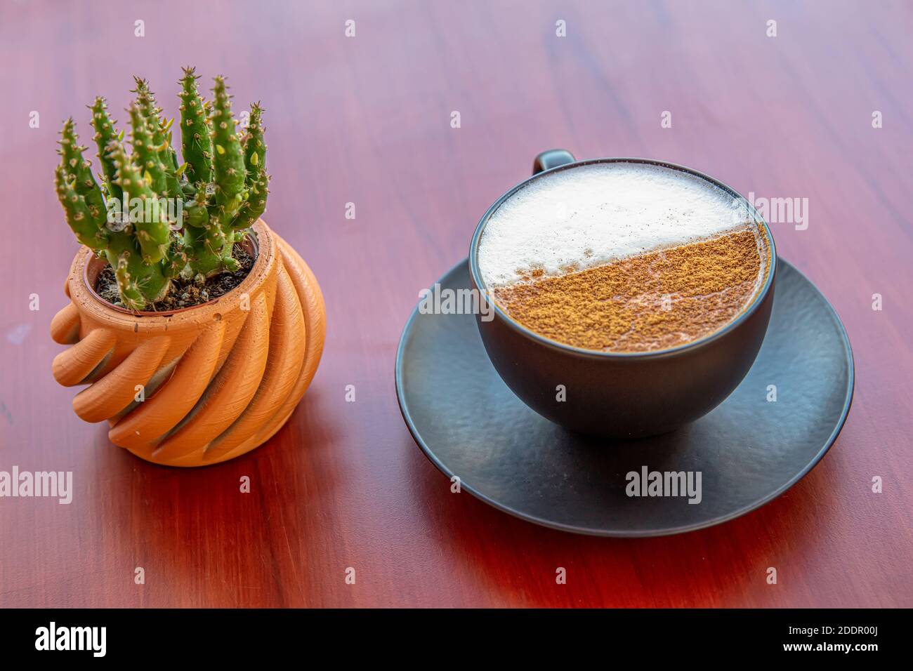 Girl's hand hold Traditional Turkish Drink Salep. Turkish salep (milky ...