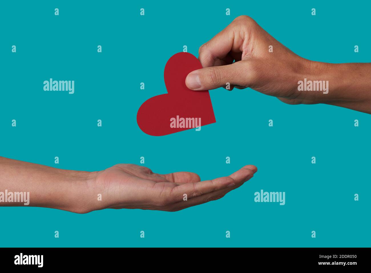 Hand giving paper another hand hi-res stock photography and images - Alamy