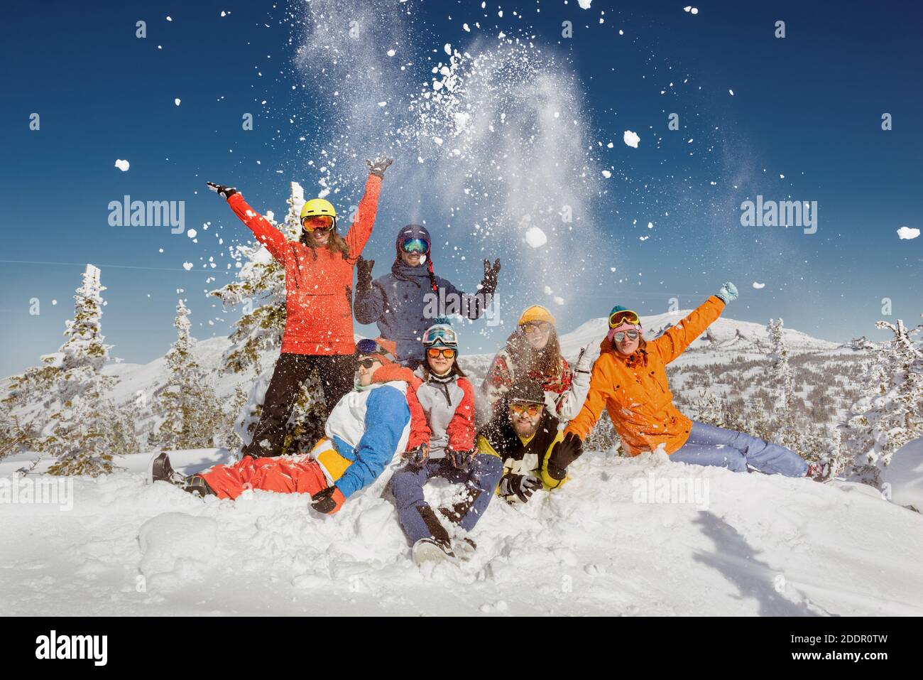 Group of young friends in colorful clothes are having fun and posing at ...