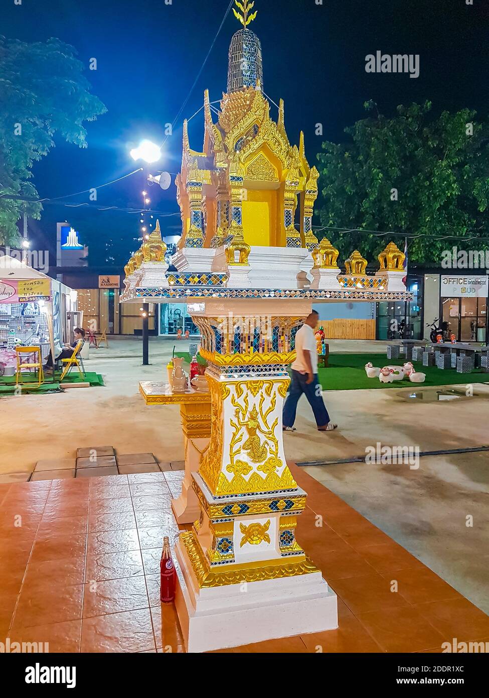 Golden yellow holy shrine at Thai night market in Huai Khwang, Bangkok ...