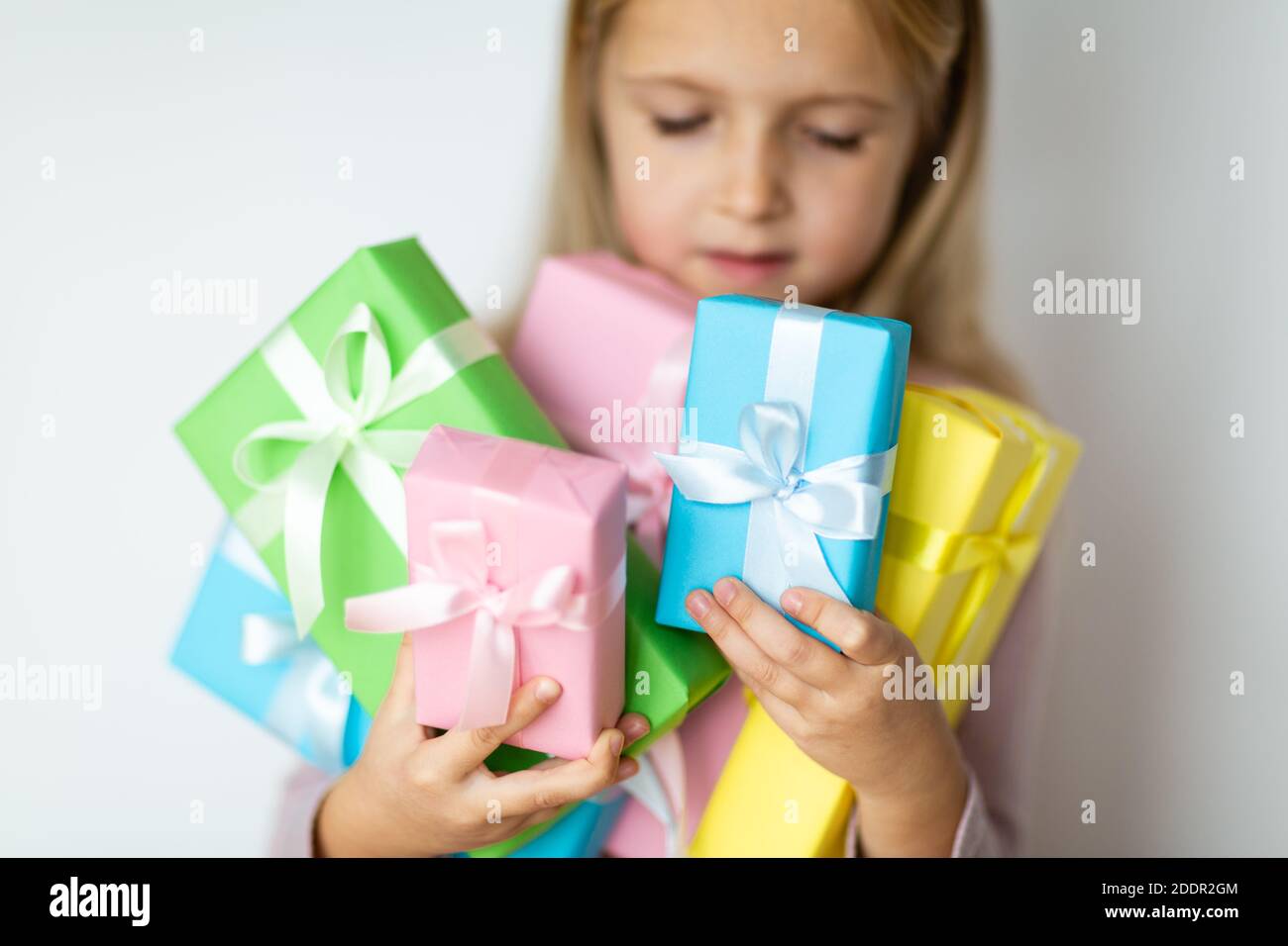 Happy kid receiving present on boxing day. Little girl smiling with ...