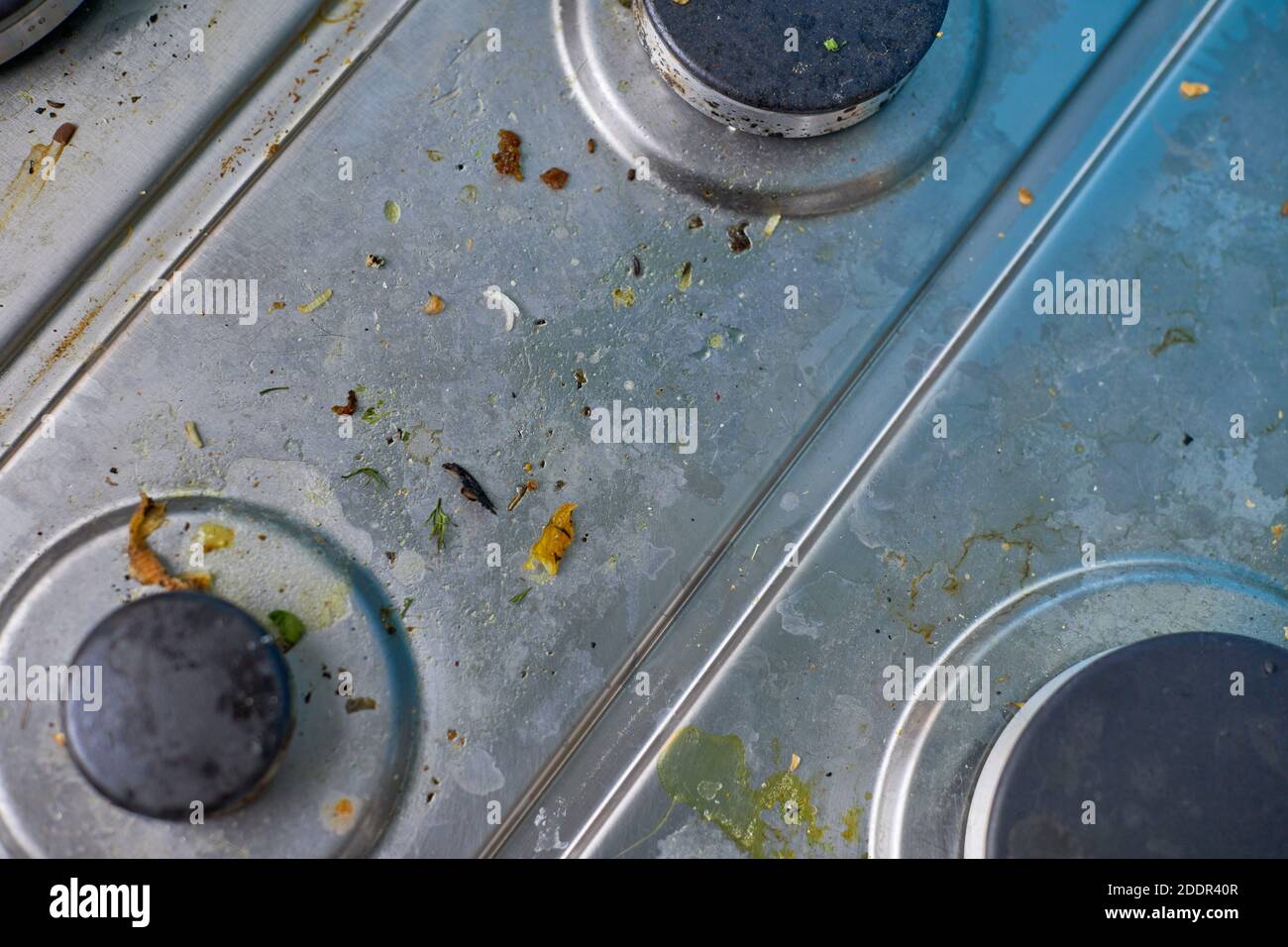 Dirty stove top with oil splatters, fat stains and food leftovers ...