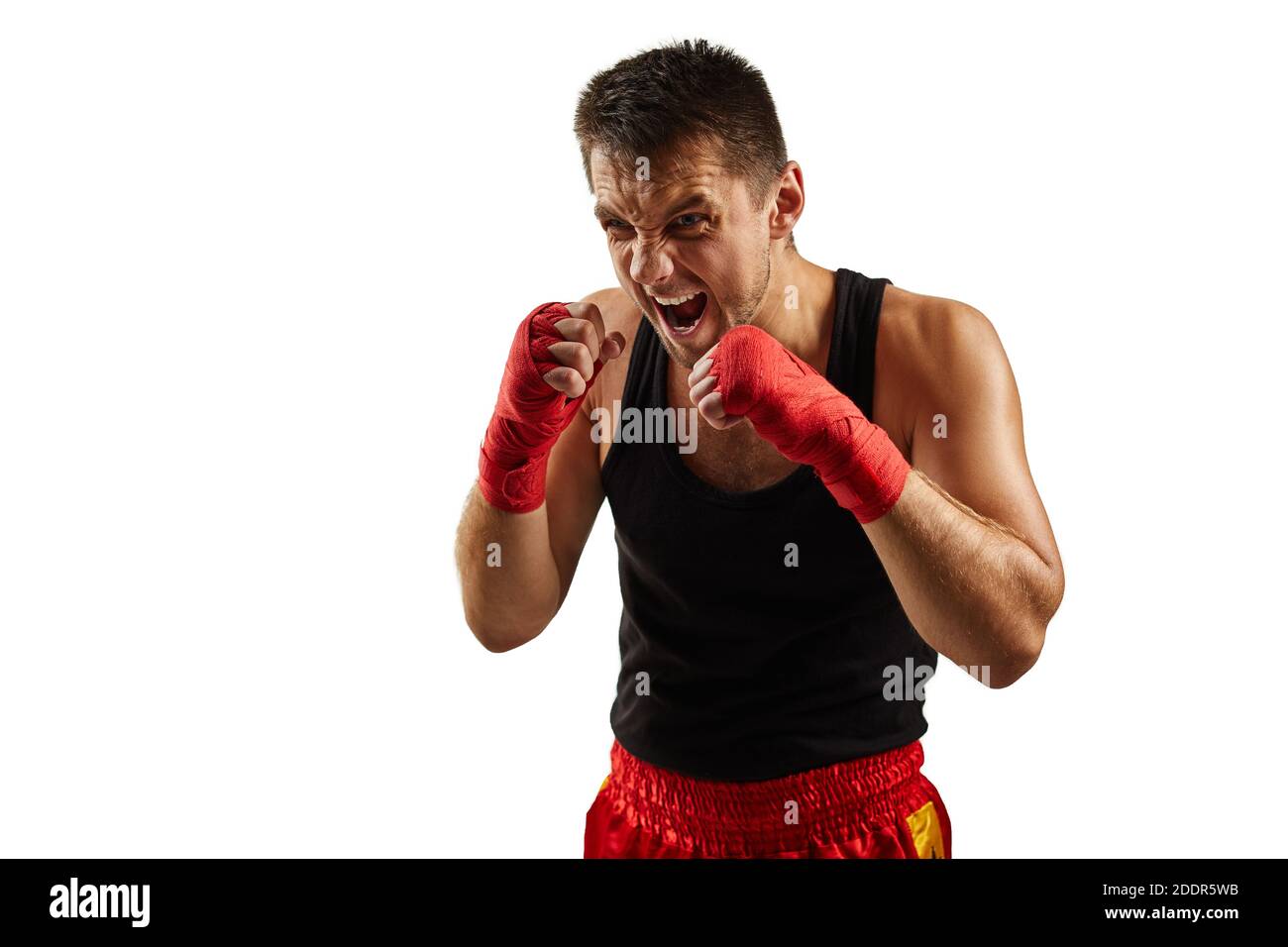 sporty man in red sports bandages throwing powerful punch isolated on ...
