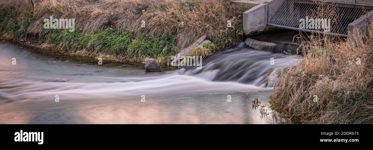 Processed and cleaned sewage flowing out from water reclamation ...