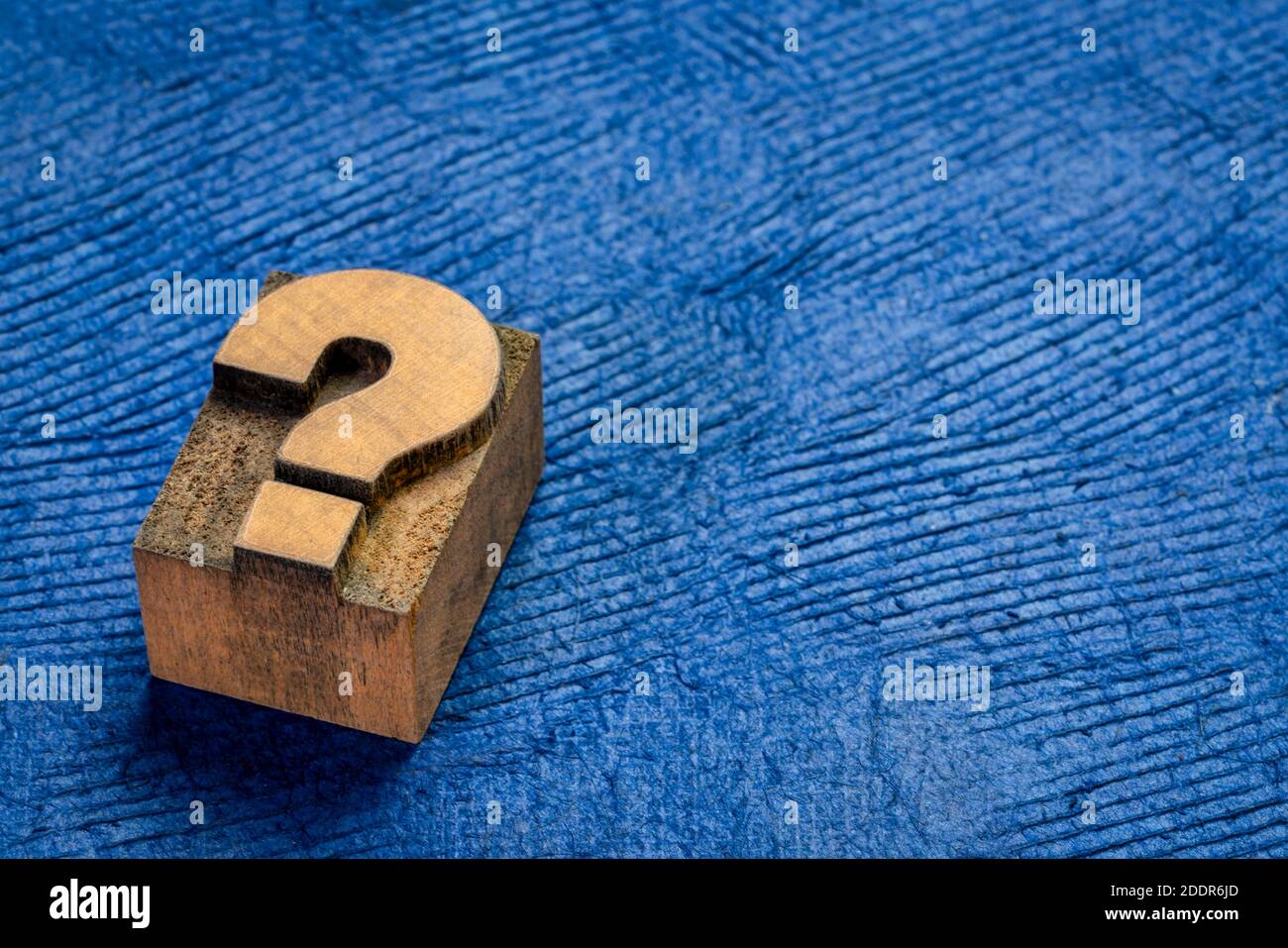 question mark - vintage letterpress printing block on blue handmade ...