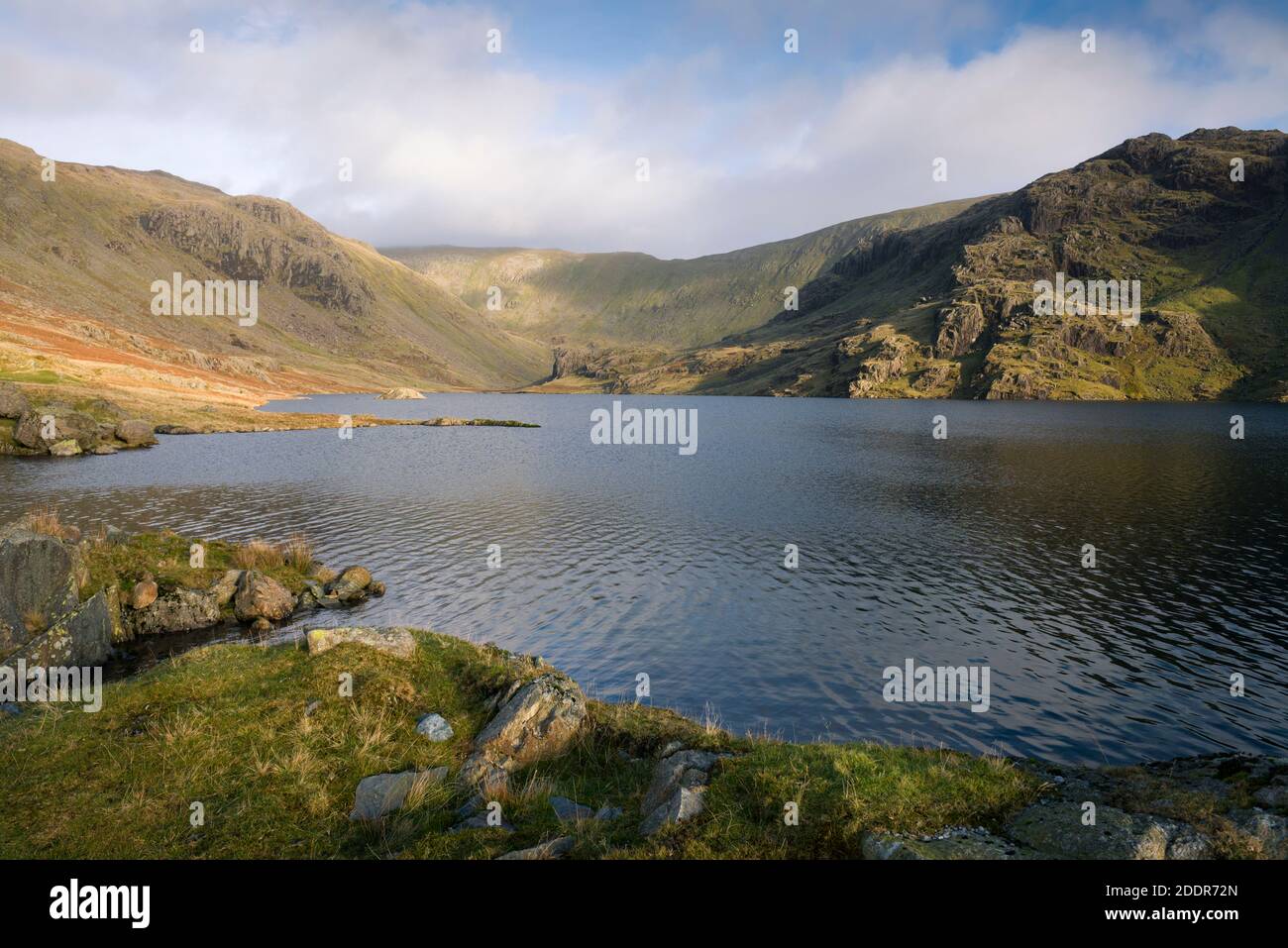 The dam of Seathwaite Tarn reservoir with Swirl How beyond in the Lake ...