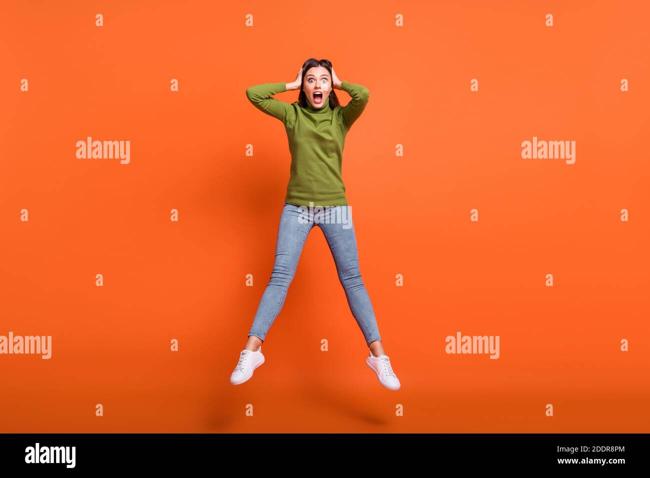 Full length photo of young girl amazed shocked scared panic news jump ...