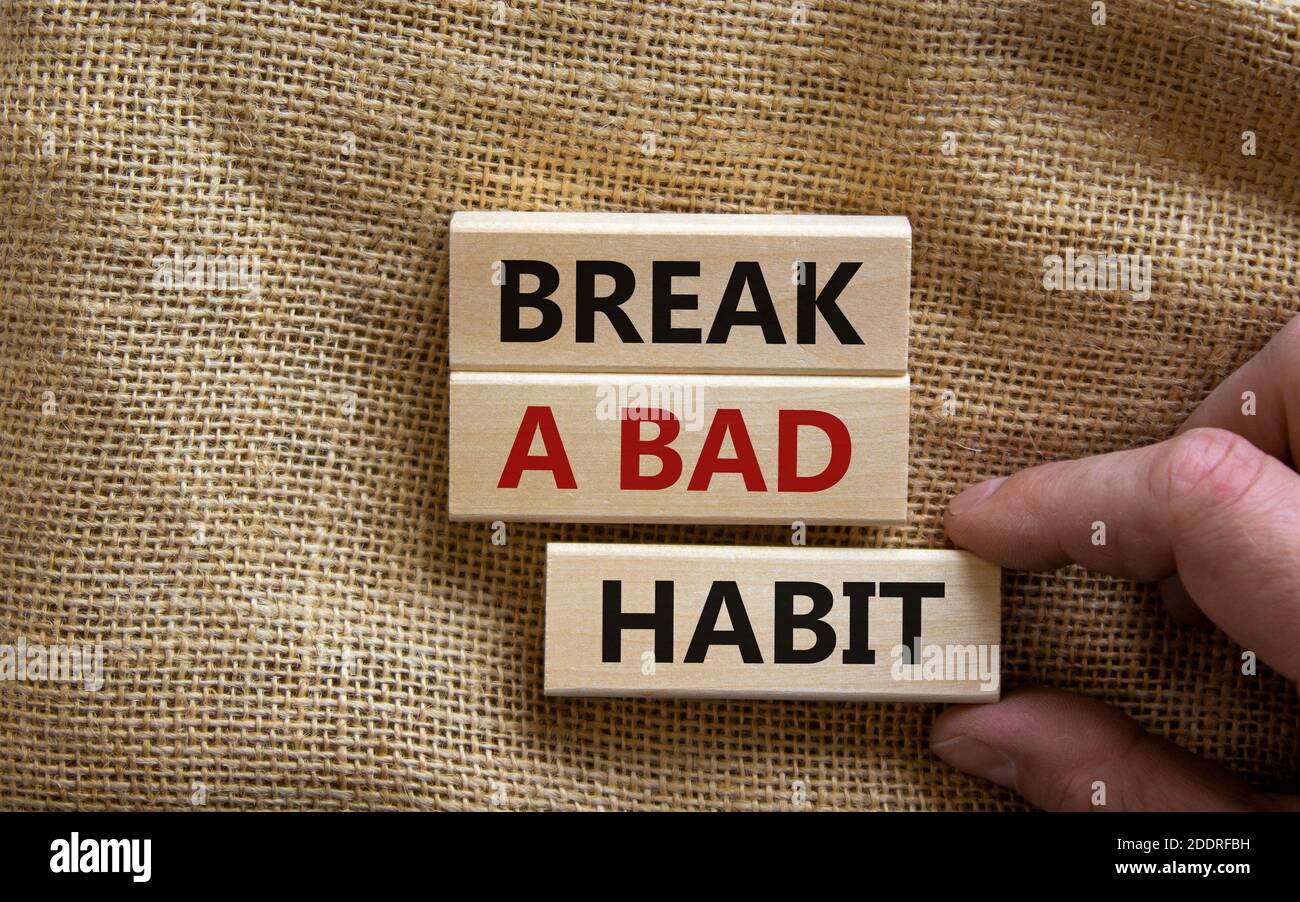 Time to break a bad habit. Wooden blocks with words 'break a bad habit ...