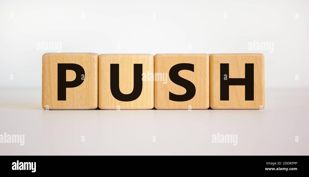 Time to push. Wooden block form the word 'push' on beautiful white ...