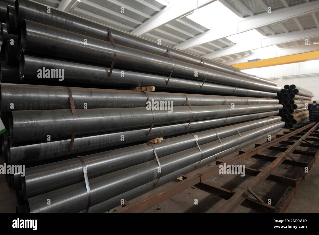 steel metal pipe stack inside factory Stock Photo - Alamy