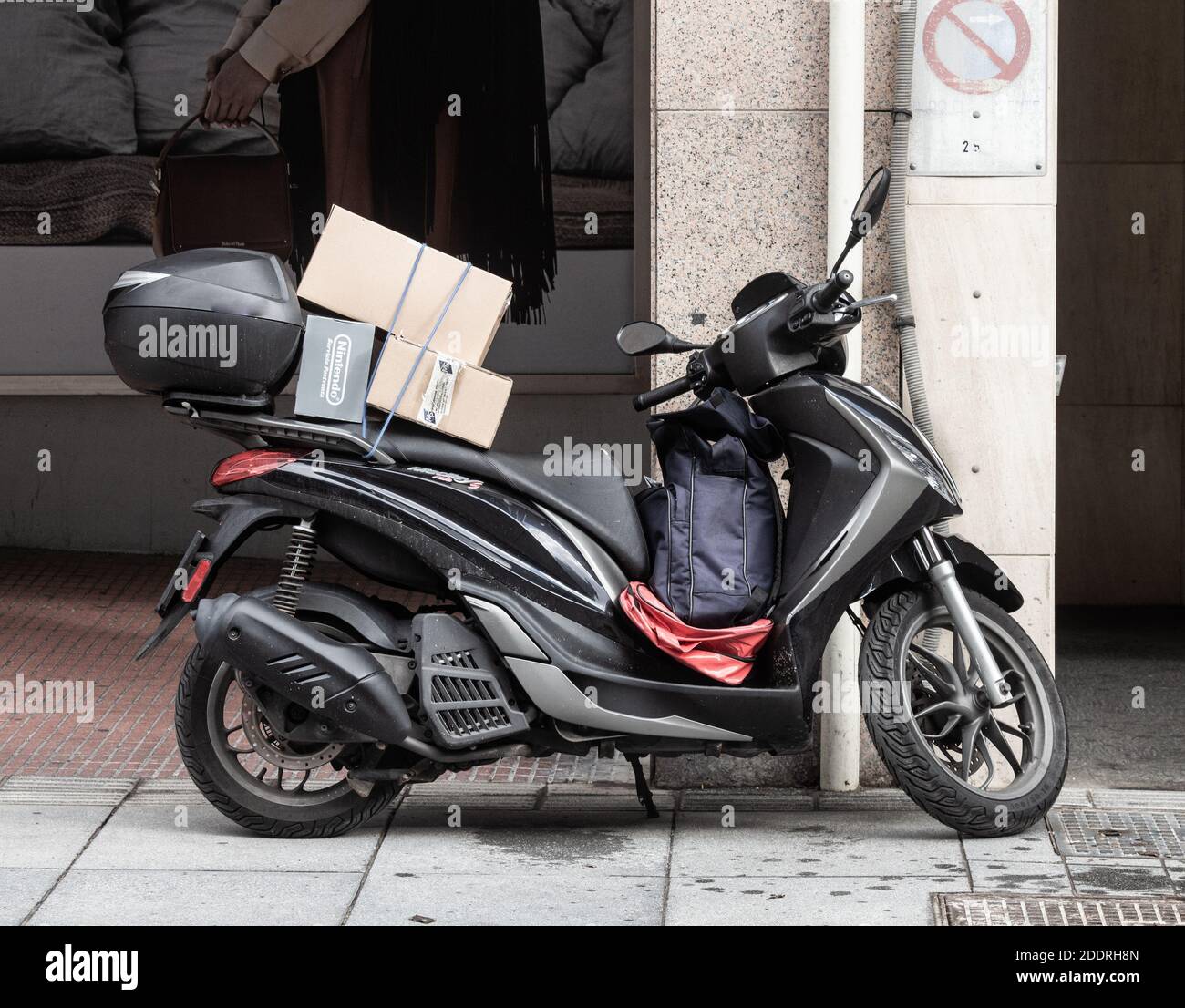 Nintendo packaging on Scooter used by courier Stock Photo - Alamy