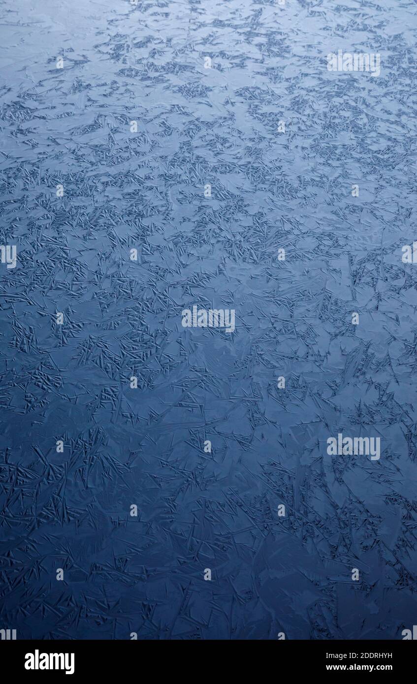 Closeup of the first ice skim layer on lake water surface at Winter ...