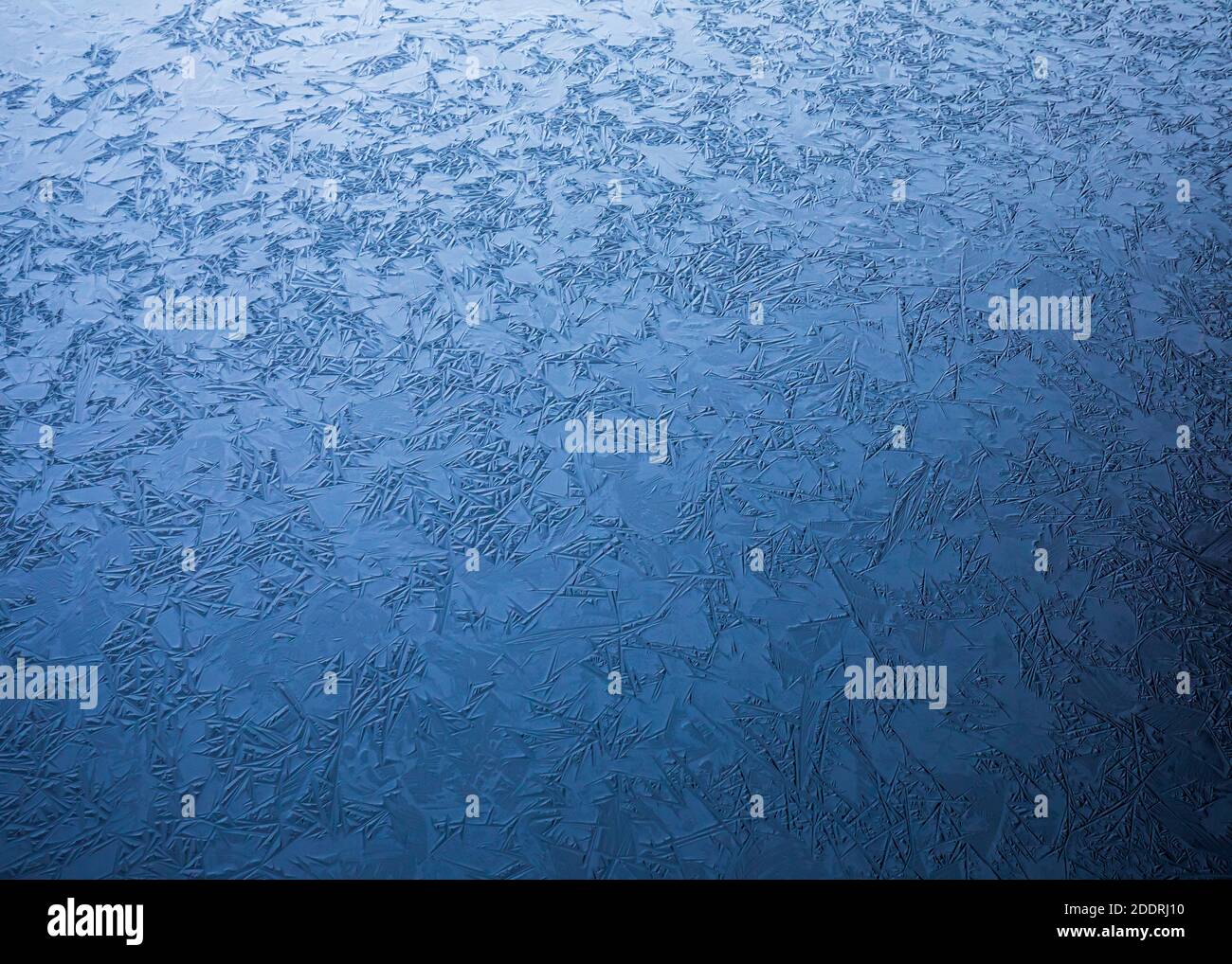Closeup of the first ice skim layer on lake water surface at Winter ...