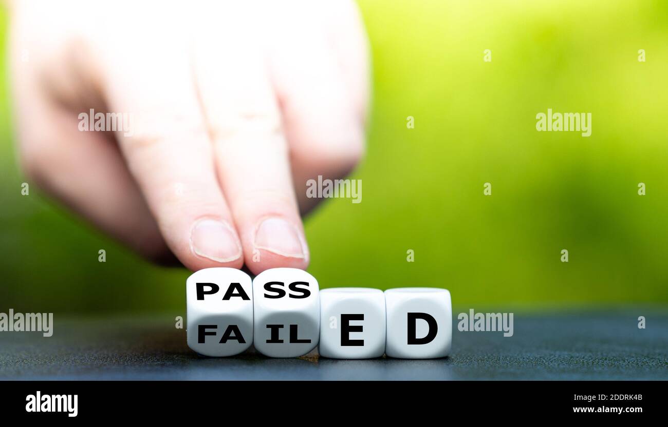 Hand turns dice and changes the word "failed" to "passed Stock Photo ...