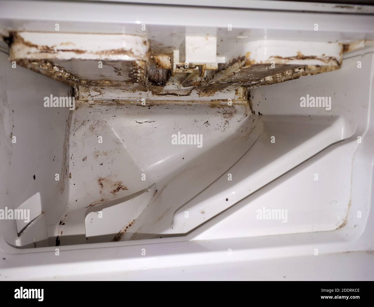 A closeup of a dirty old fridge cabin under the lights Stock Photo - Alamy