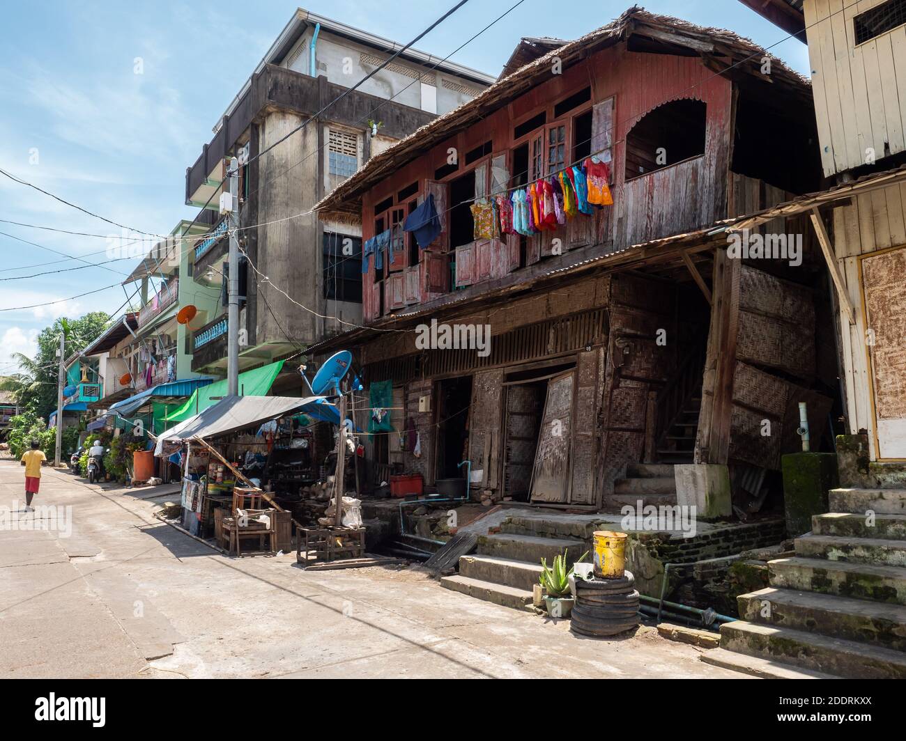 Local street with traditional, wooden houses in Myeik, Tanintharyi ...