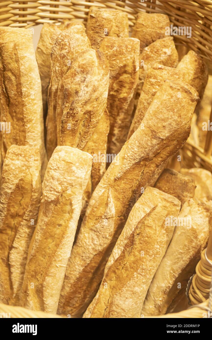 A top view closeup of french baguette loaves of bread in a basket at ...