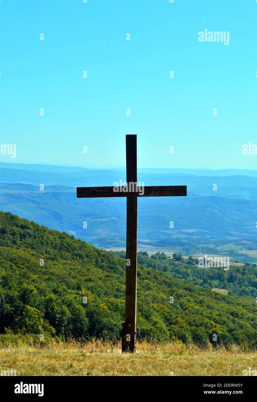 A closeup of a wooden cross on the scenic nature background Stock Photo ...