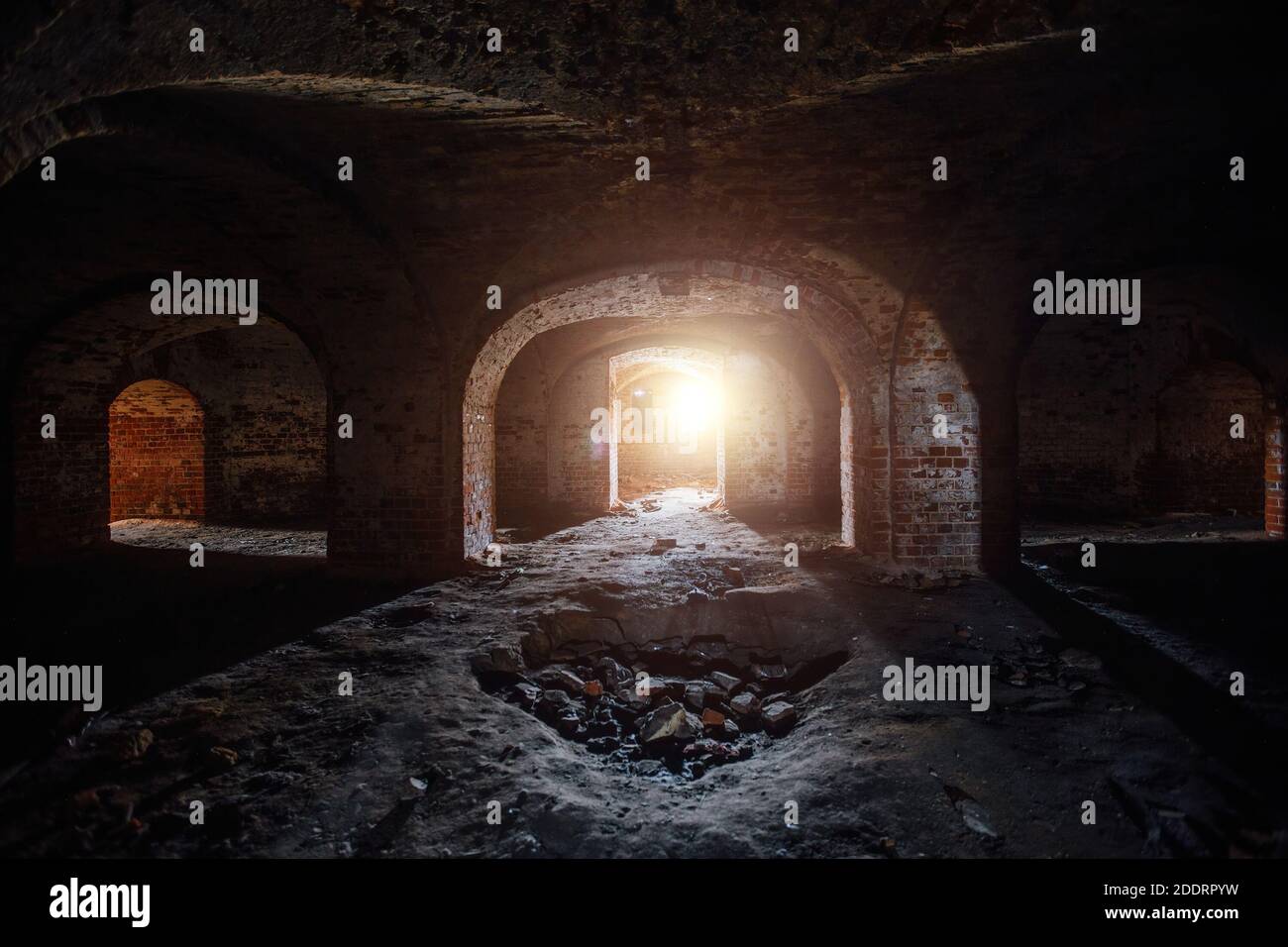 Dark and creepy vaulted red brick dungeon Stock Photo - Alamy