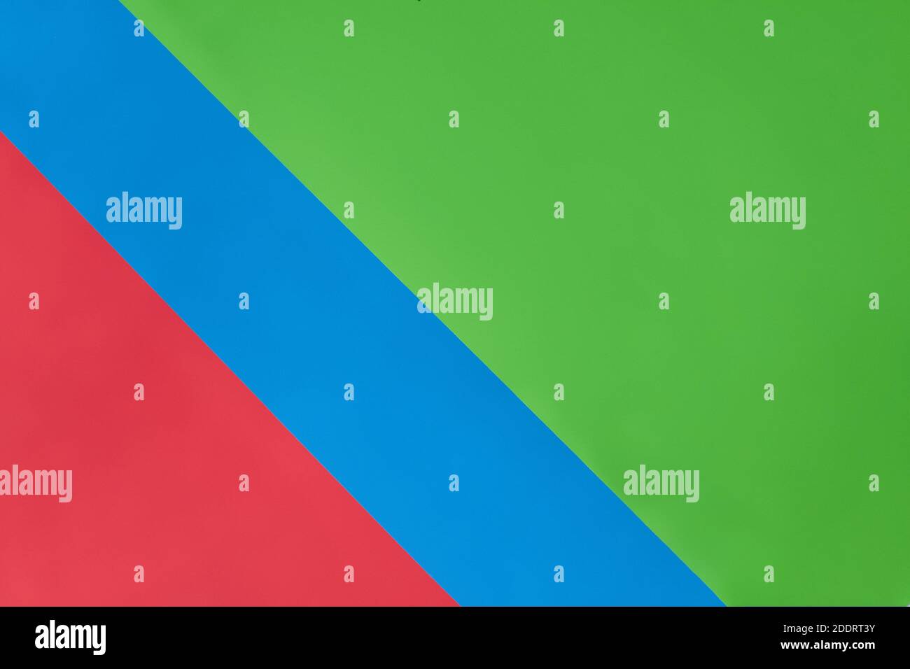 Multicolored background consisting of stripes of red, blue and green ...