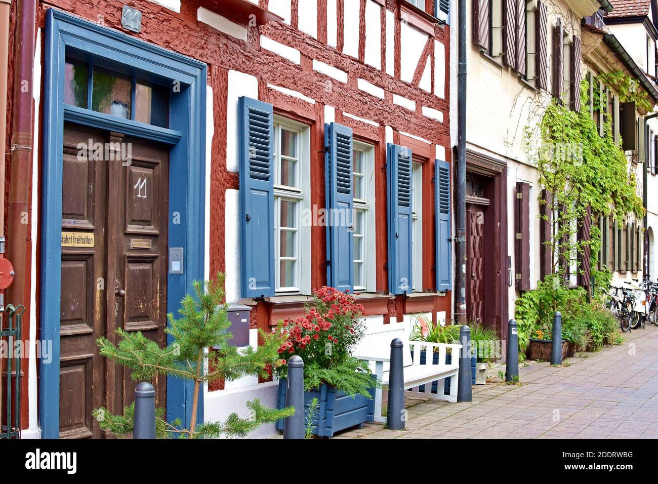 German traditional colorful wooden houses along the little pedestrian ...