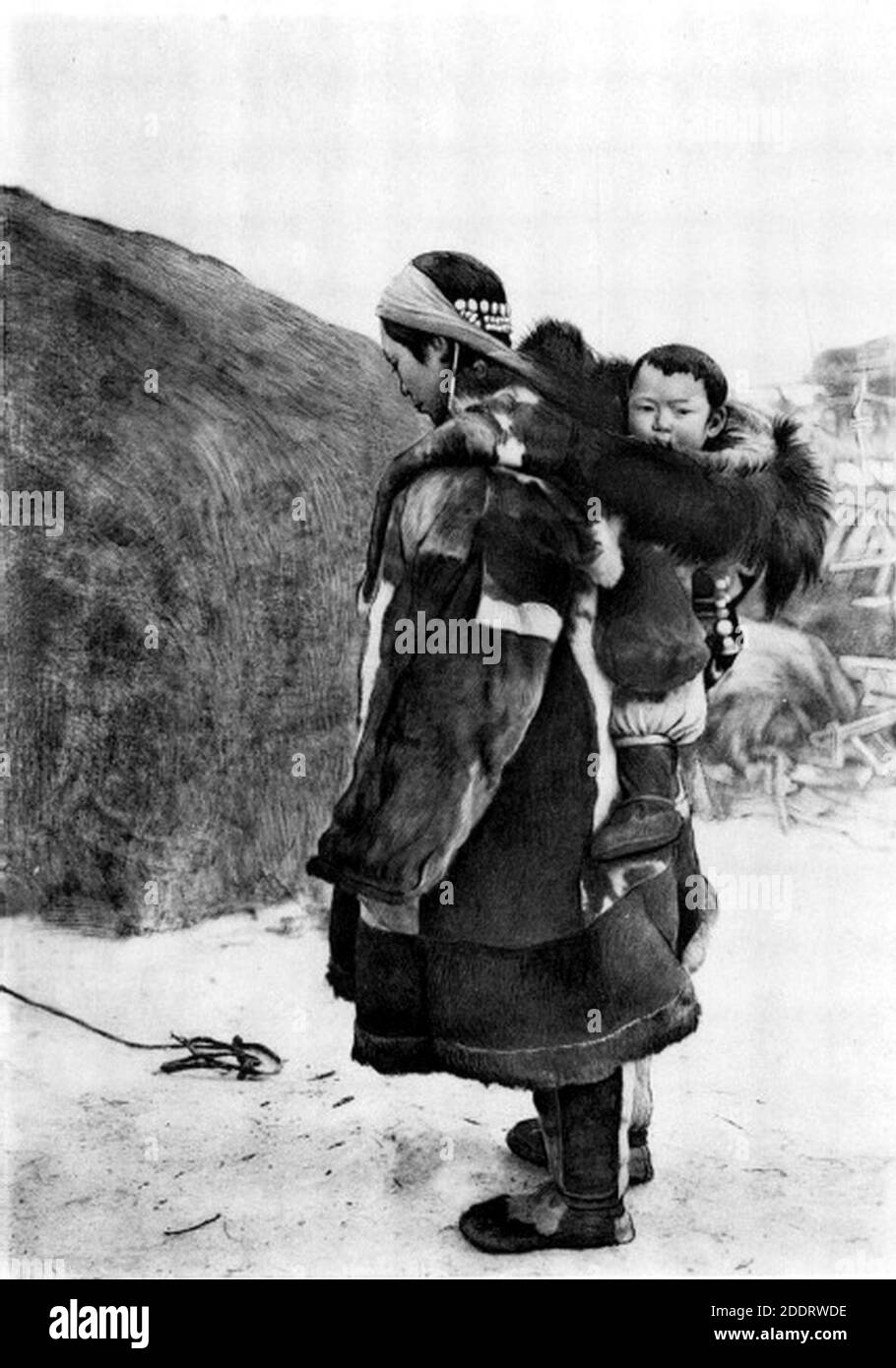 Koryak woman carrying child Stock Photo - Alamy