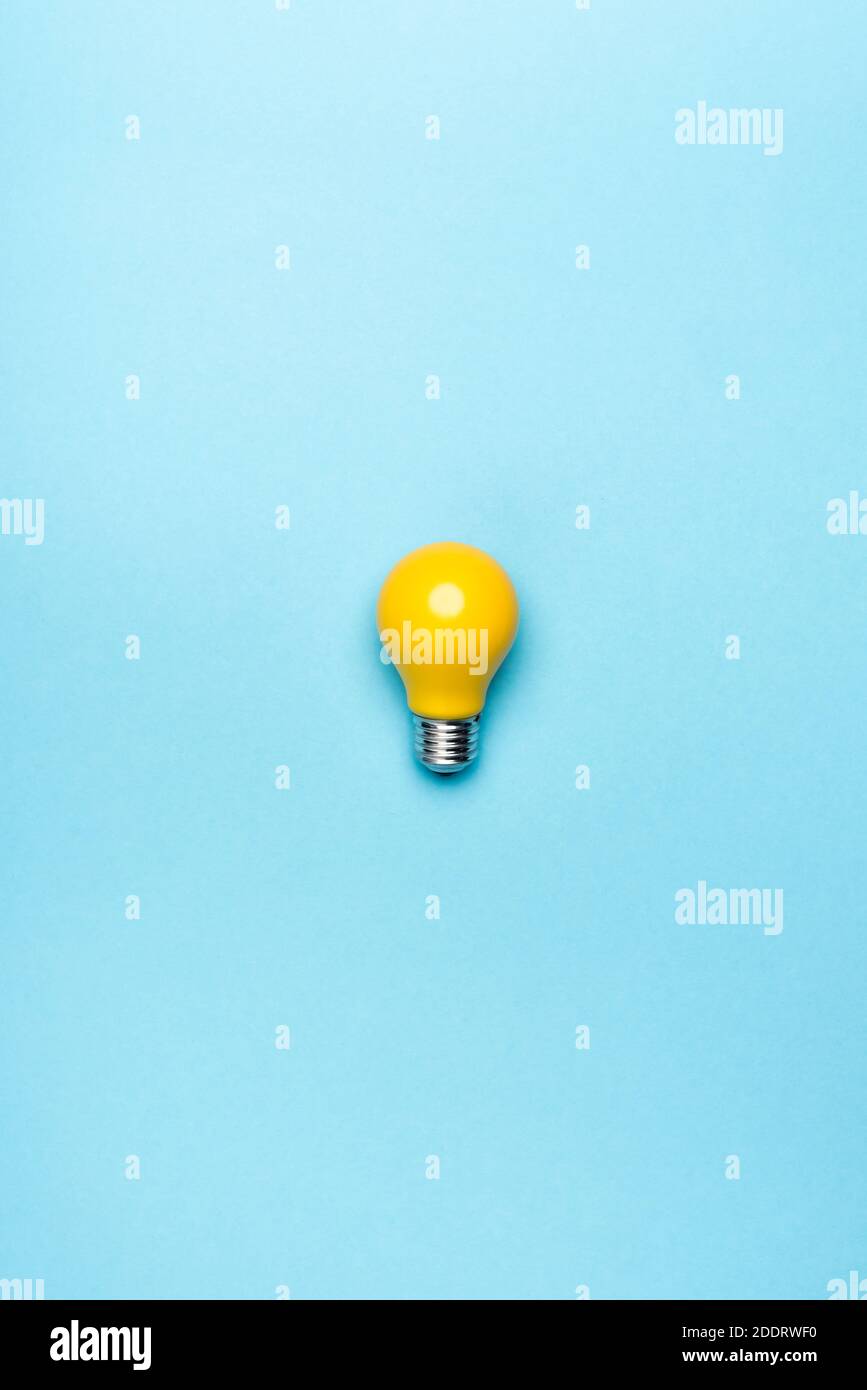 Glowing light bulb blue yellow hi-res stock photography and images - Alamy