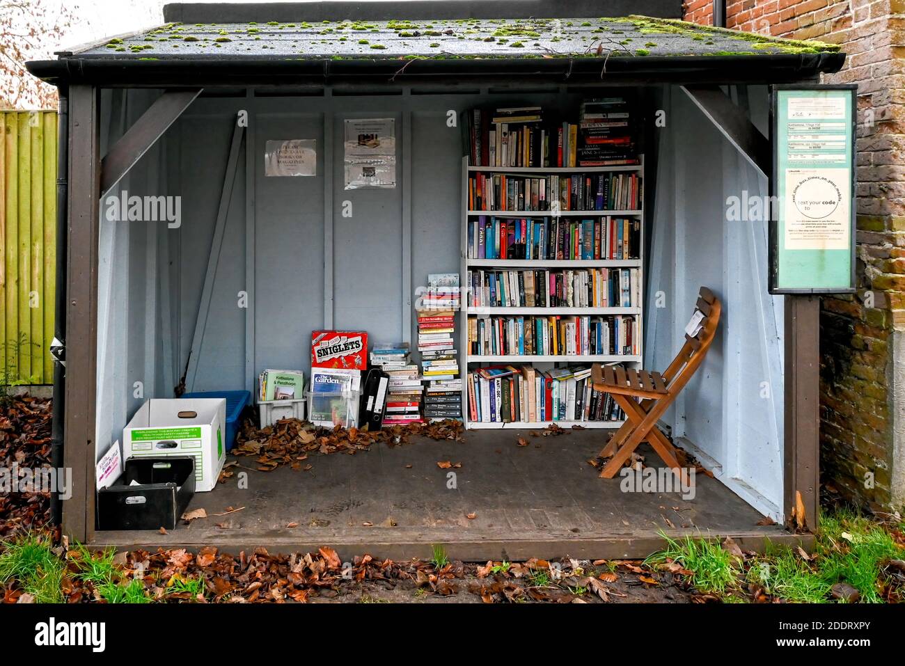 Old wooden bus shelter converted into a lending library for books and ...