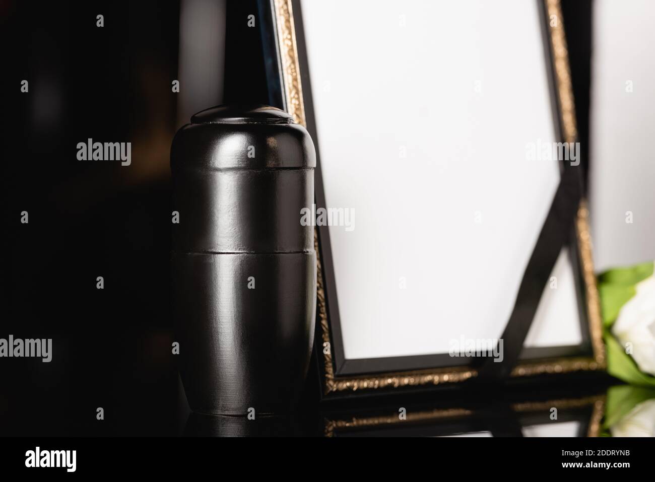 mirror with black ribbon and urn with ashes, funeral concept Stock ...