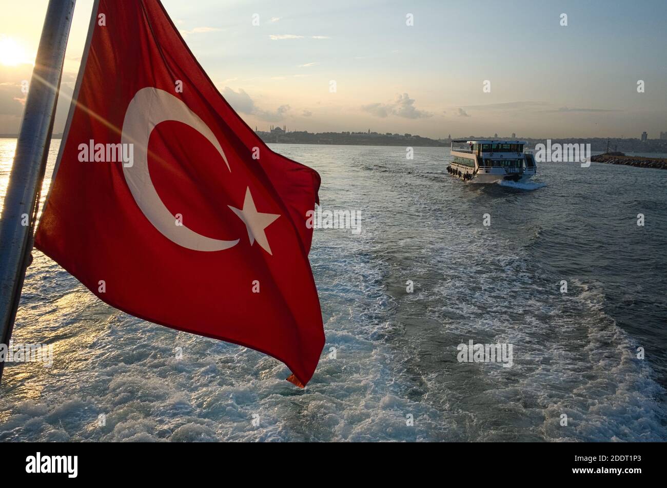 Red Turkish flag close up on the ferry boat against water and waves in ...