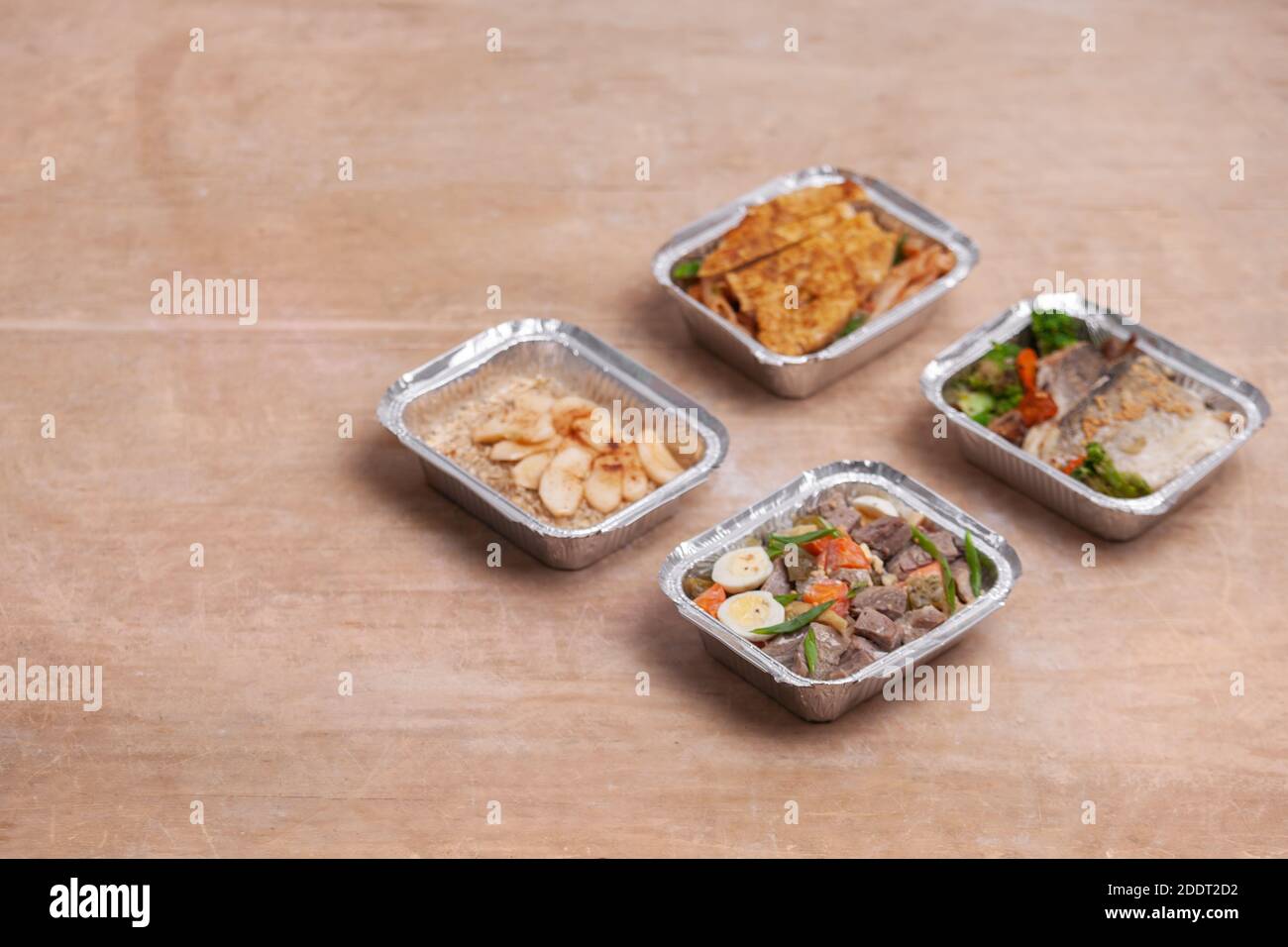 take away lunch boxes with fresh meal in foil container or healthy food ...
