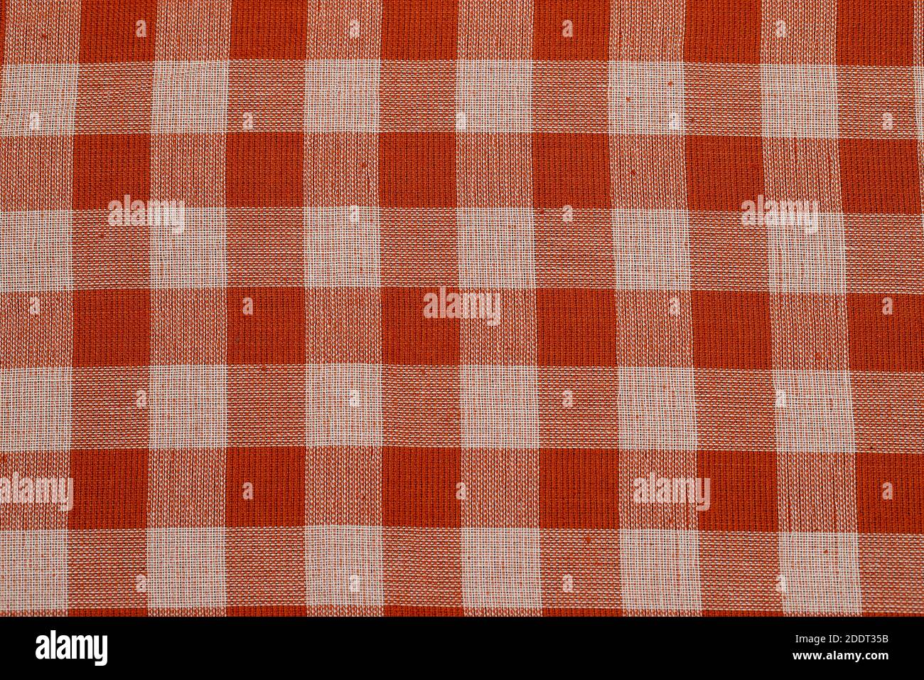 Textile background with checkered red tablecloth, top view. Texture of ...