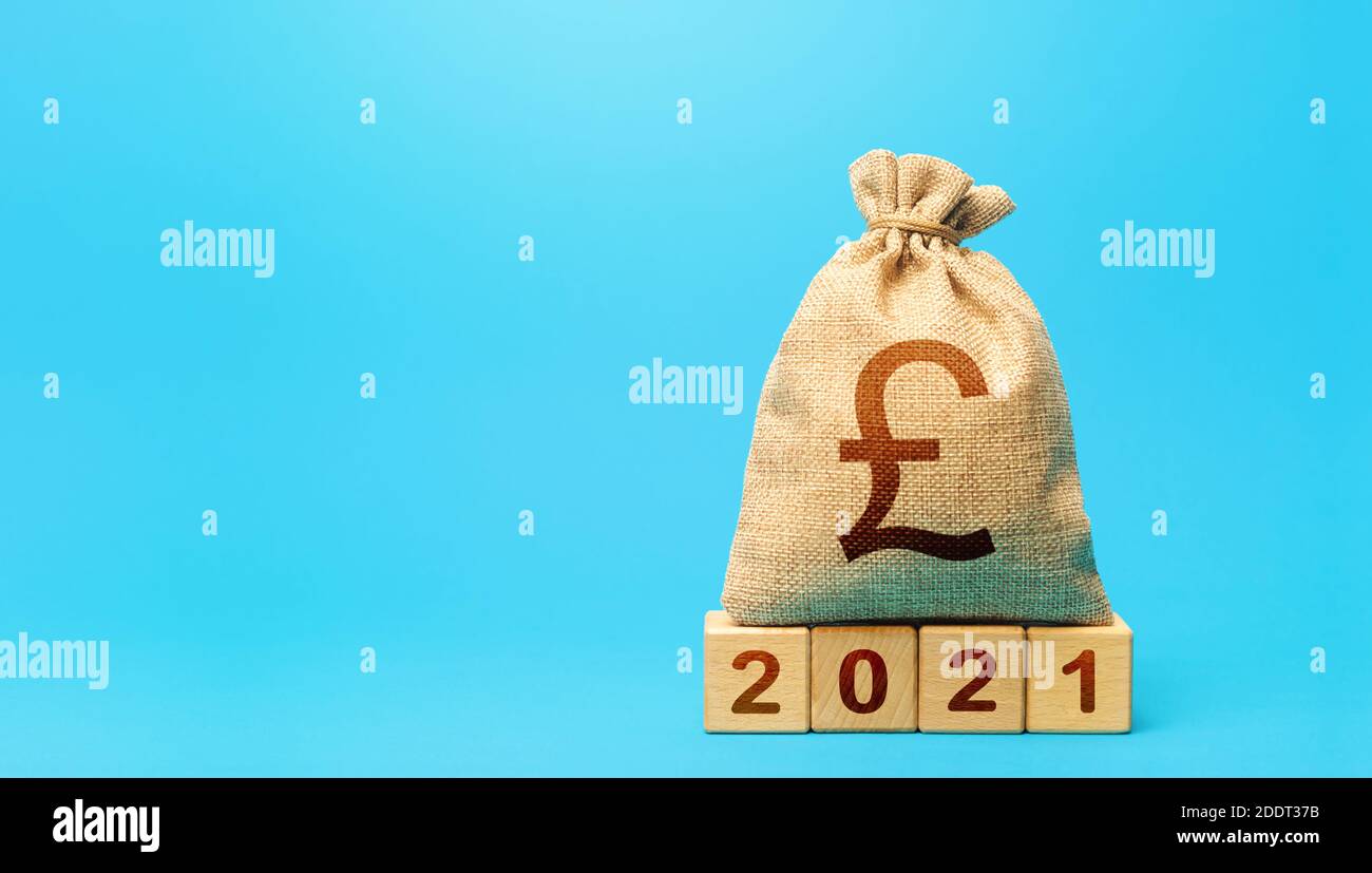 British pound sterling money bag and blocks 2021. Budget planning for ...