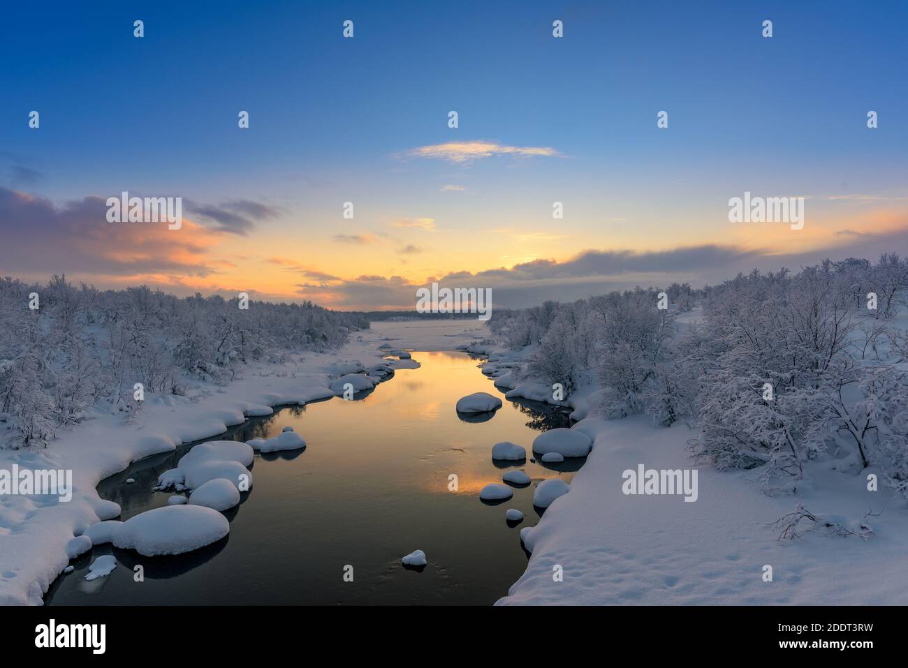 Winter sunset over the Teriberka river above the Arctic Circle in the ...