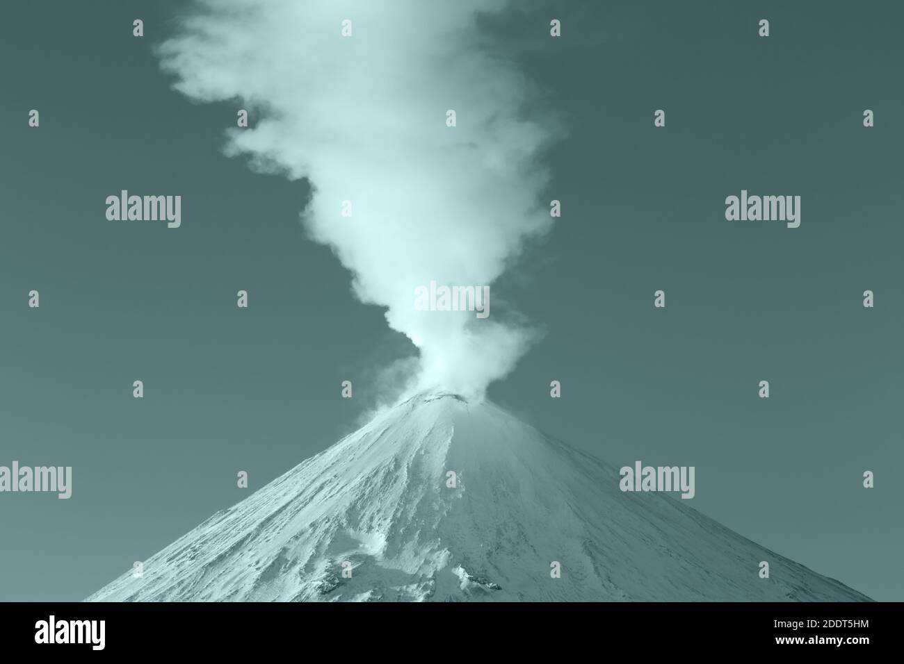 Winter eruption active volcano, plume from crater steam, gas, ashes ...