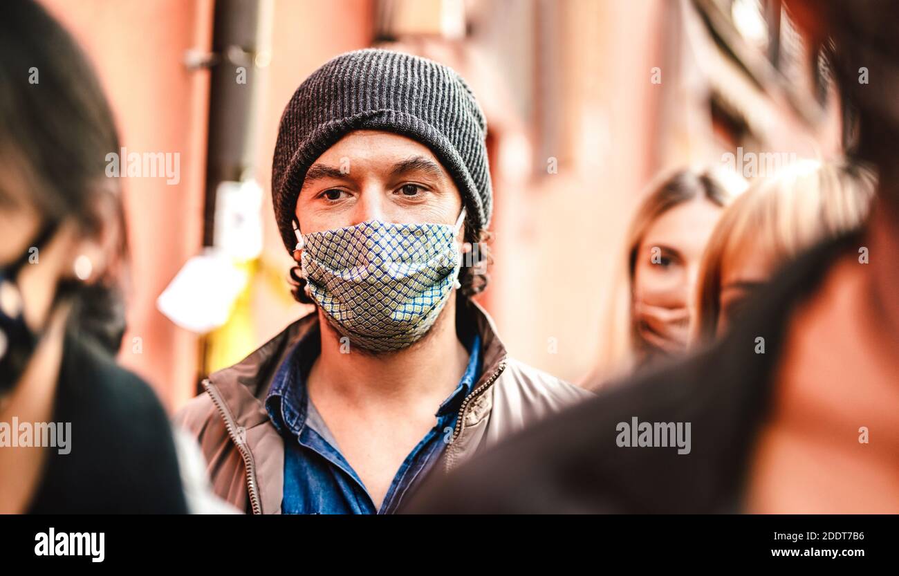 Urban crowd of citizens walking on city street wearing face mask - New ...