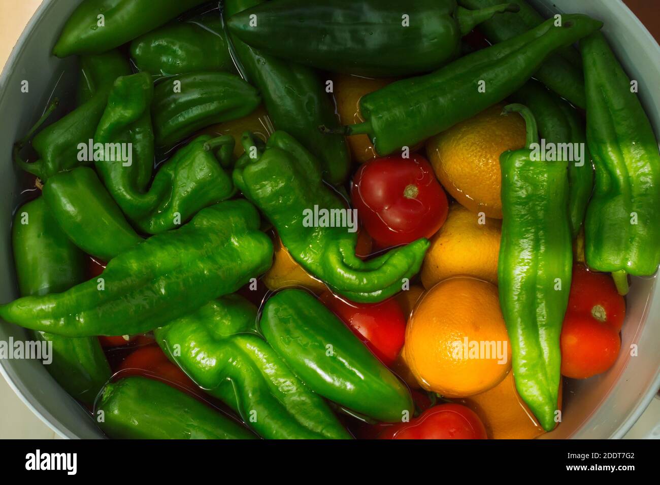 Overhead view of some fruits and vegetables in the water. A flexible ...
