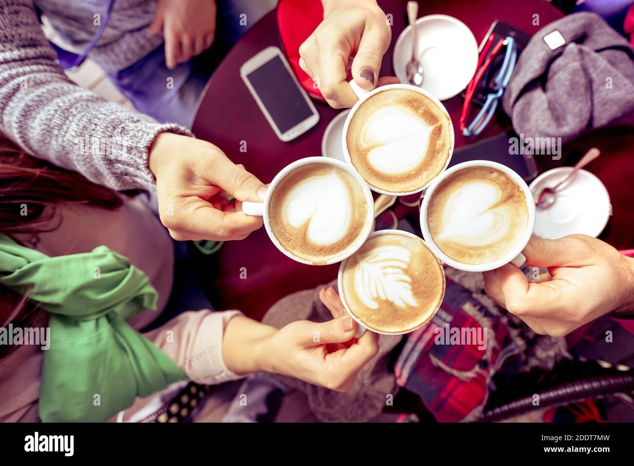 Group of friends drinking cappuccino at coffee bar restaurant - People ...